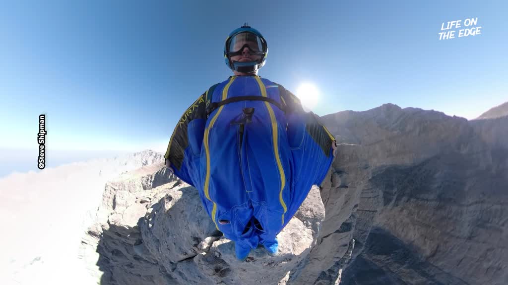 Daring wingsuit flyer leaps off mountain peak