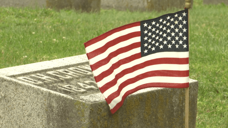 Planting flags for veterans leading into Memorial Day weekend