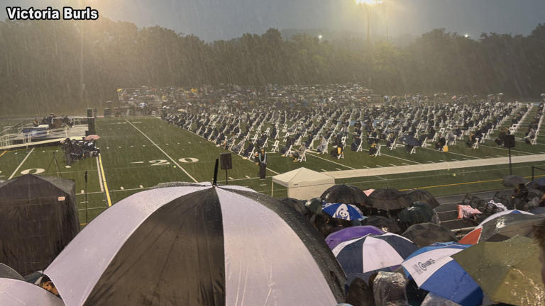 Centennial, Franklin high schools hold graduations in torrential downpour