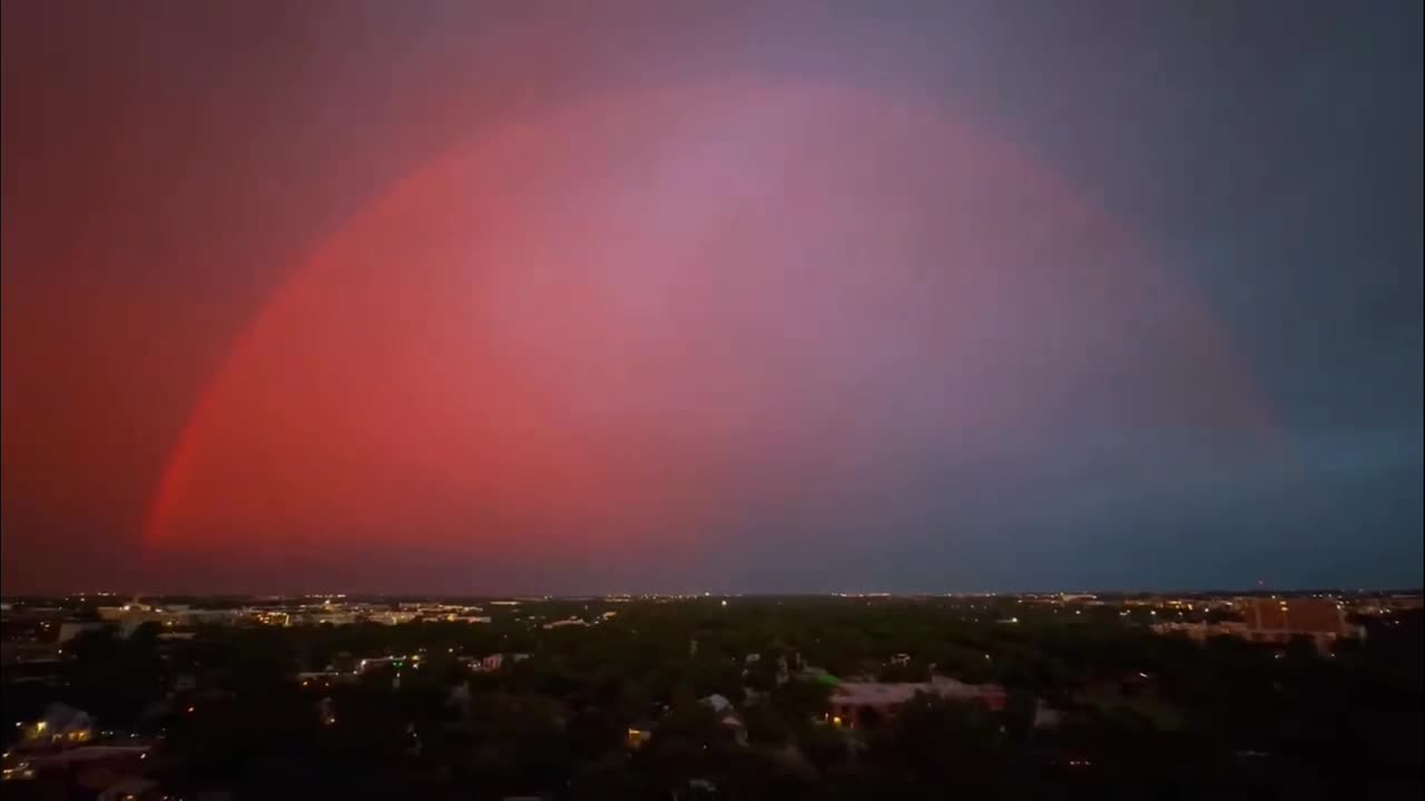 Lightning flashes through rare red rainbow over Austin sky during Texas ...