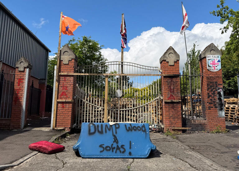 UDA and bonfire flags erected near contentious north Belfast pyre