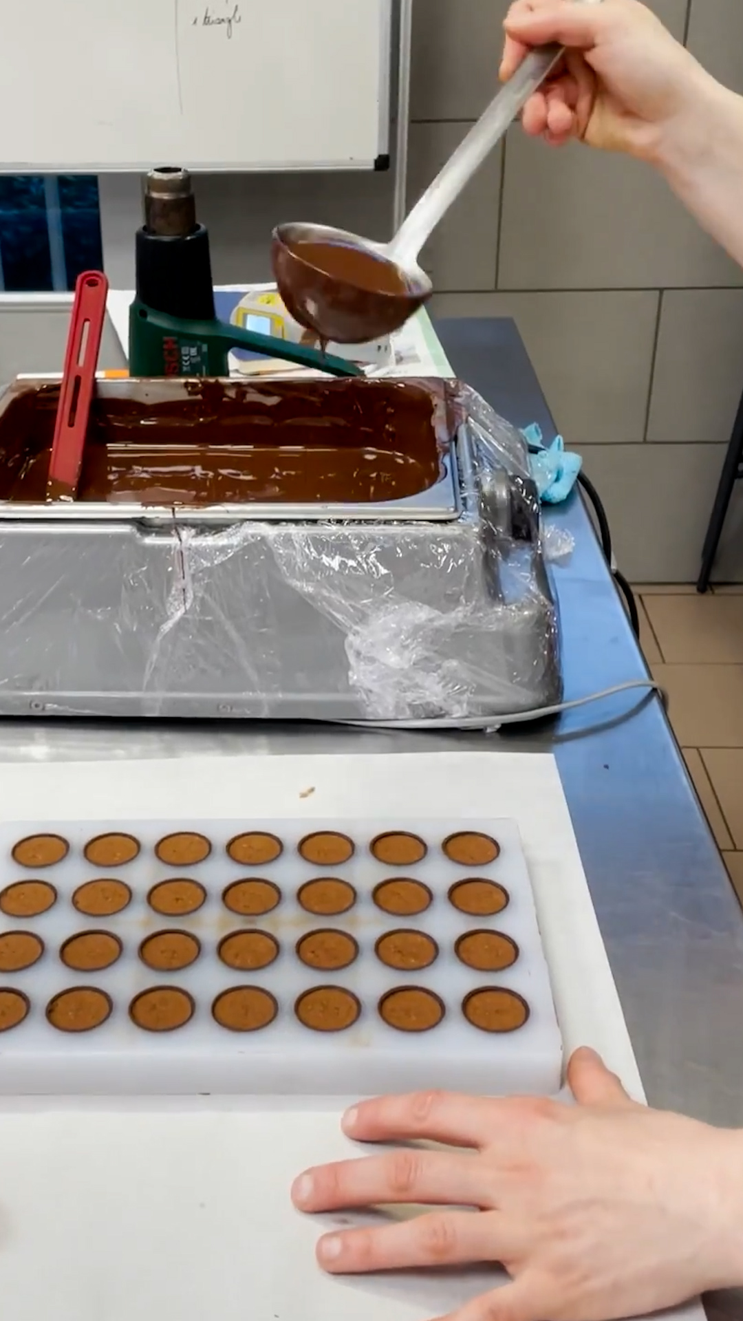 Crafting professional chocolate bonbons at pastry school