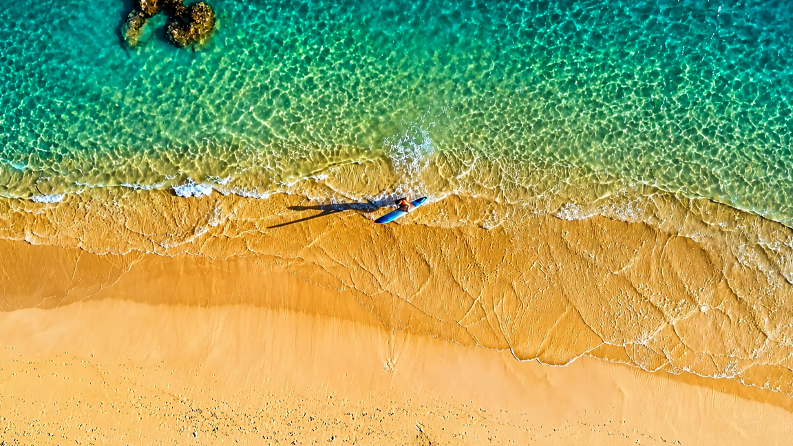 Beautiful coastal landscape featuring golden sand and clear water