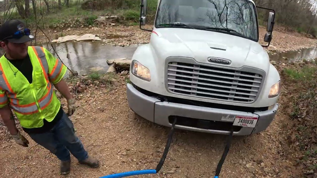 Box truck in a creek
