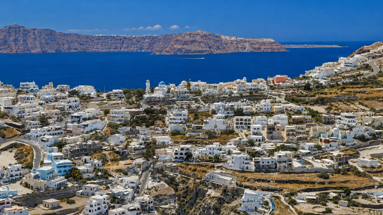 Santorini white village overlooking the deep blue Aegean