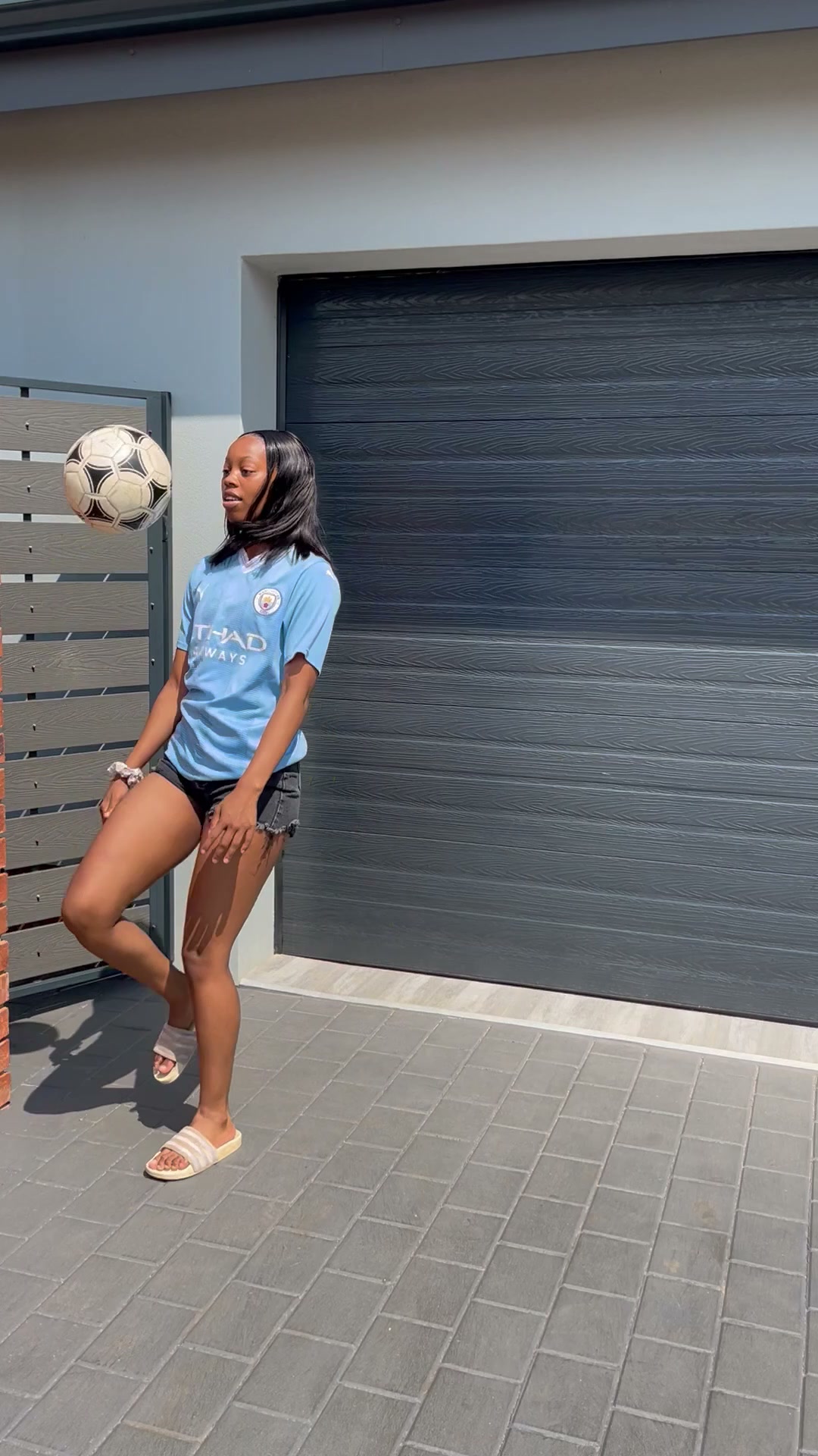 Girl showing off backyard soccer juggling skills