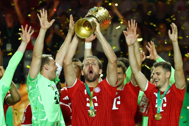 Soccer-Kane hat-trick hands Bayern German Cup victory and domestic double