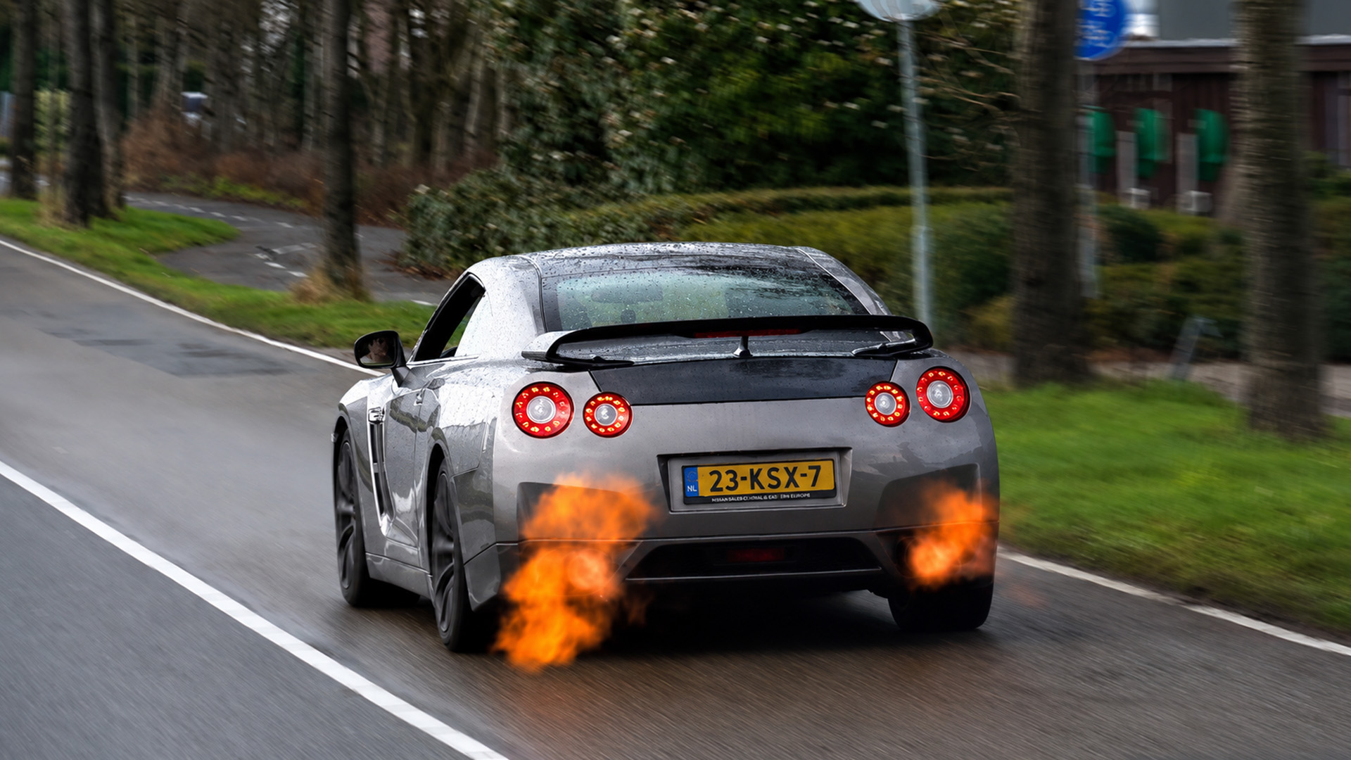 Nissan GTR shoots flames while accelerating on open road