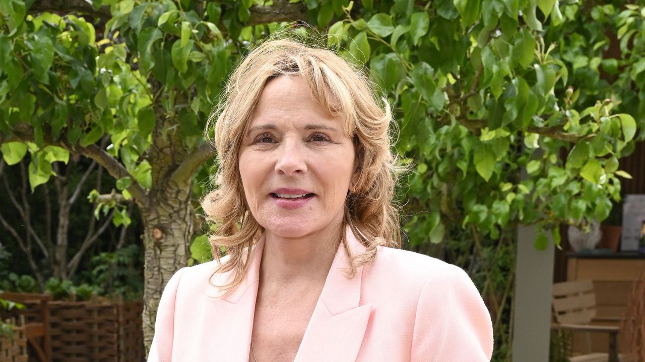 Kim Cattrall looks polished in a pink blazer and white trousers at RHS ...