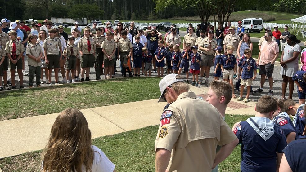 Cub Scouts place flags on 2,700 graves at Alabama veterans cemetery in ...