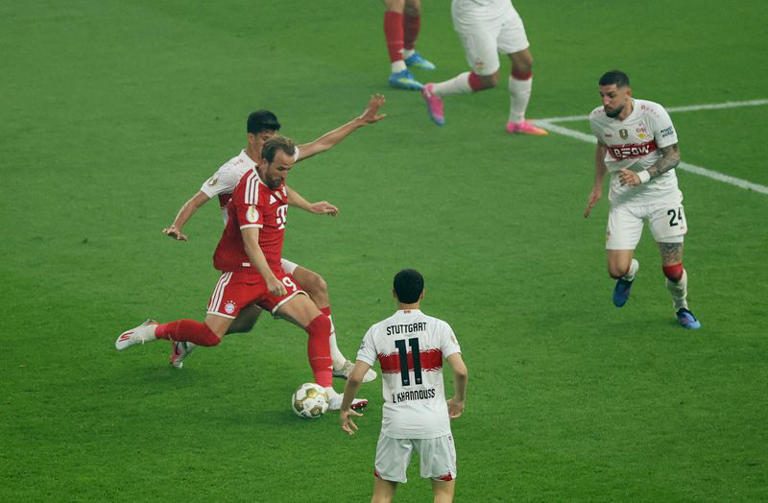 Soccer-Kane hat-trick hands Bayern German Cup victory and domestic double