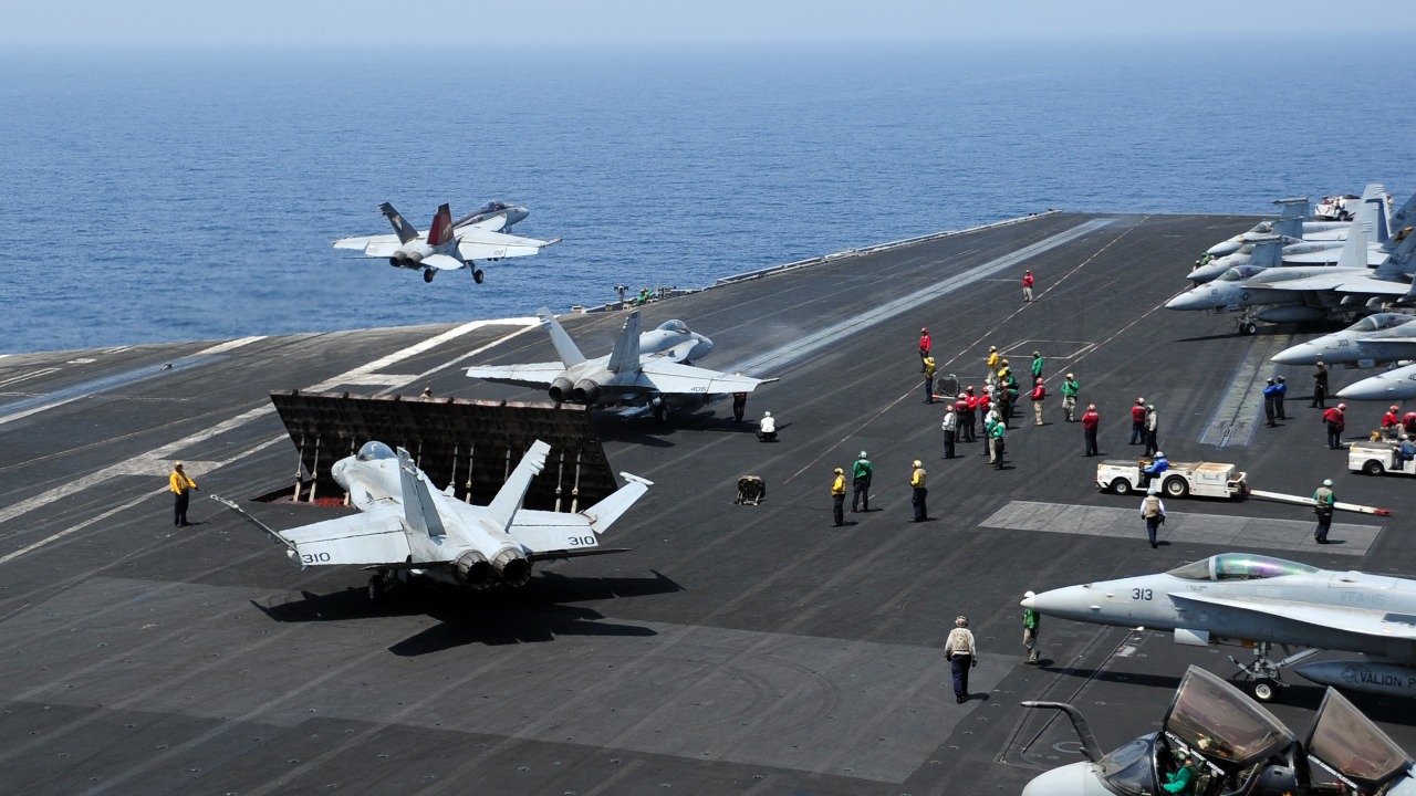 More than 20 US warships and two carrier groups are still holding the ...