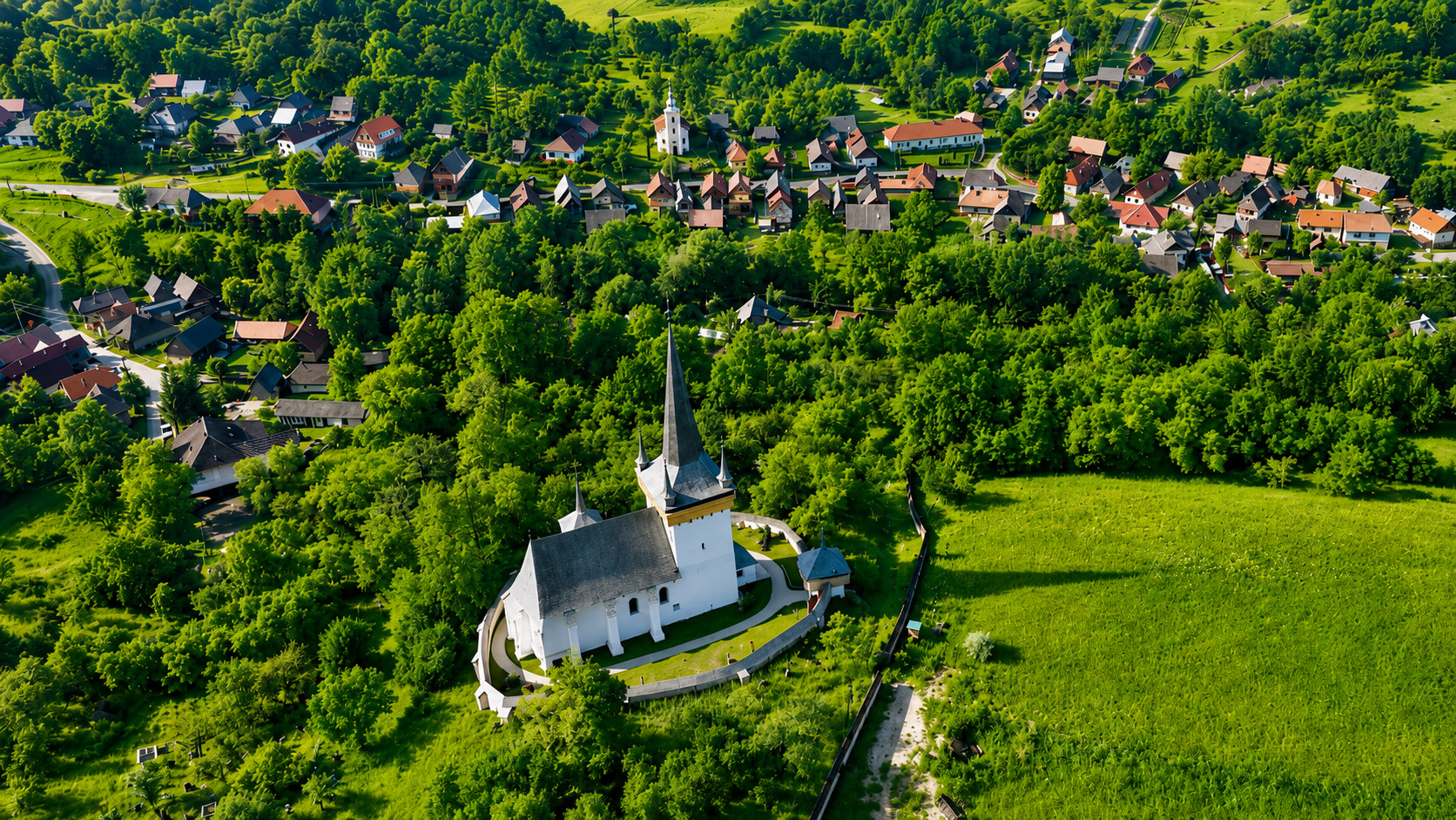 A medieval church surrounded by the quiet hills of Transylvania