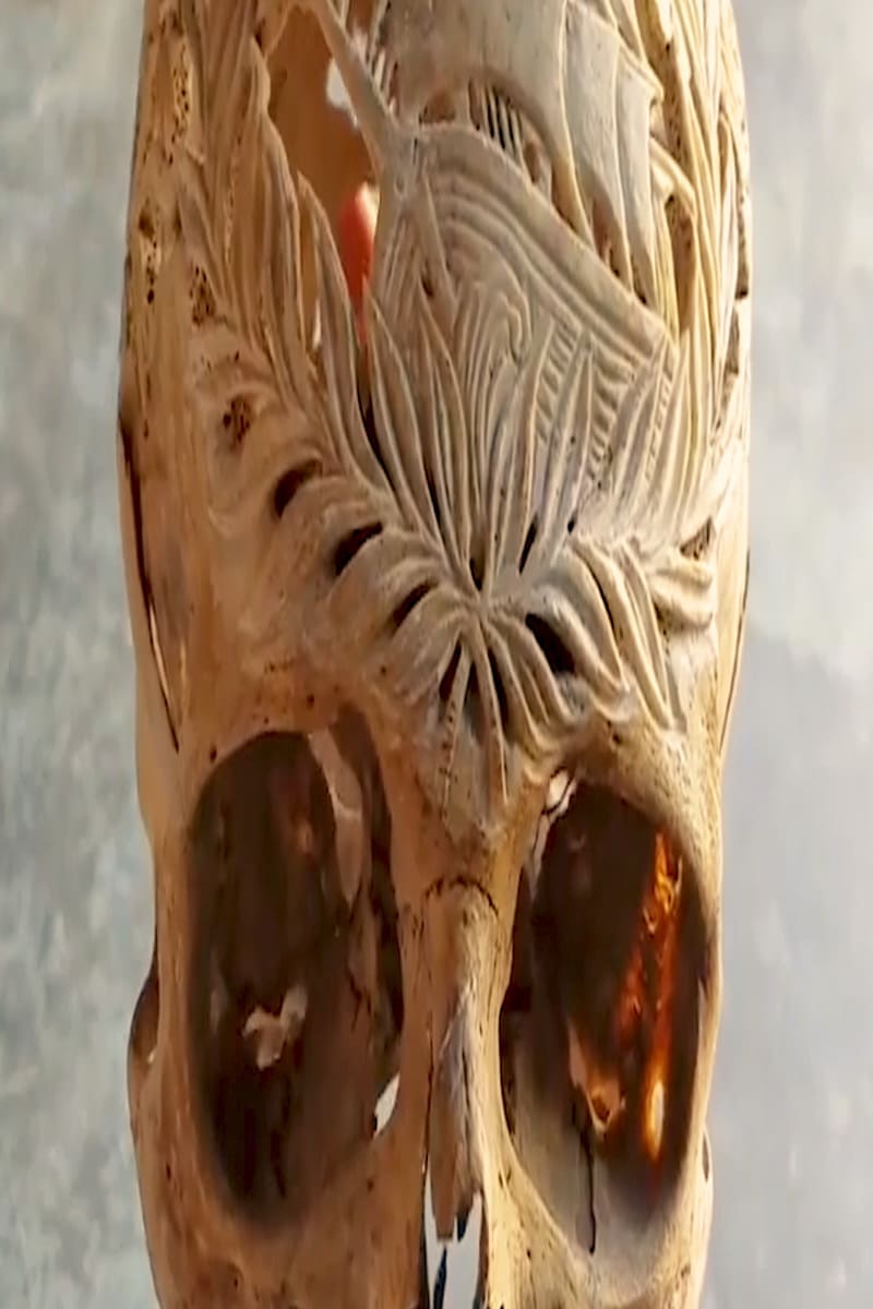 Artist creates intricate human skull carvings