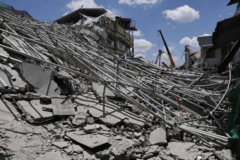 21 missing after nine-story building collapses as 'voices' heard ...