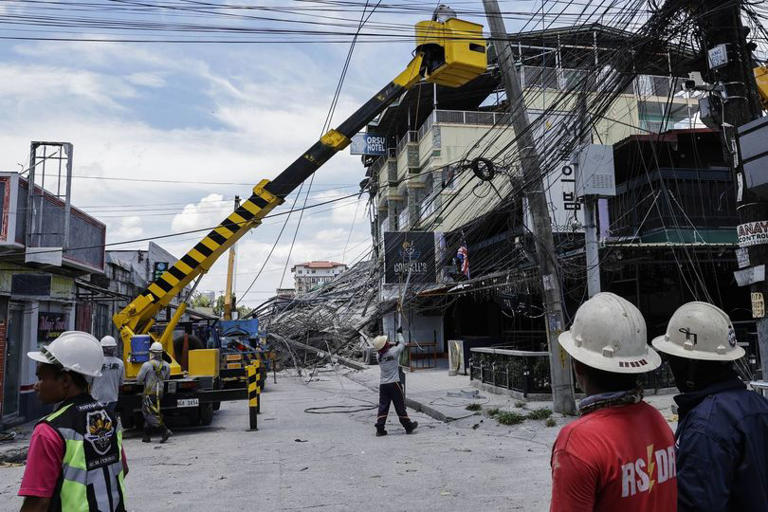 21 missing after nine-story building collapses as 'voices' heard ...