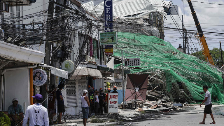 People trapped under collapsed building in Philippines