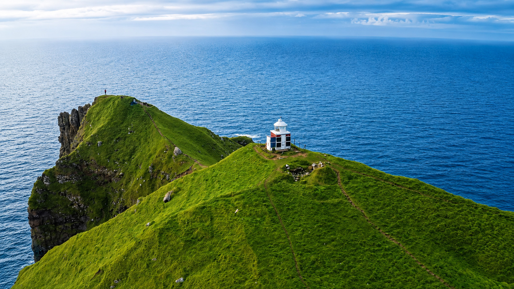 A remote lighthouse guarding the ocean cliffs