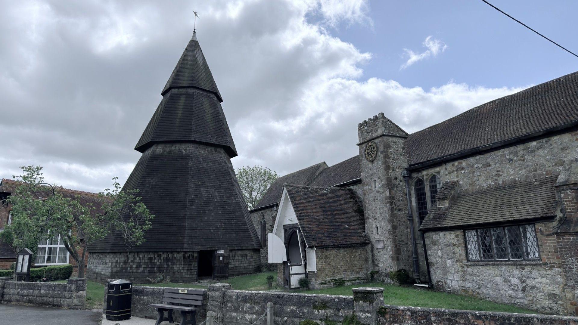 The church with its steeple built next door