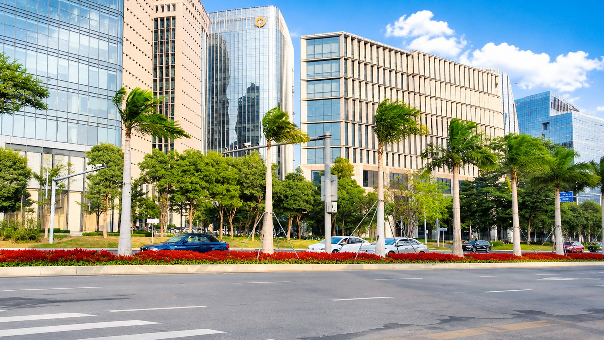 Walking through China’s business district lined with red flower gardens