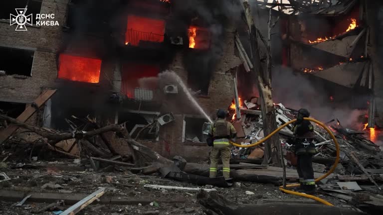 Kyiv firefighters carry out rescue operation after massive Russian attack
