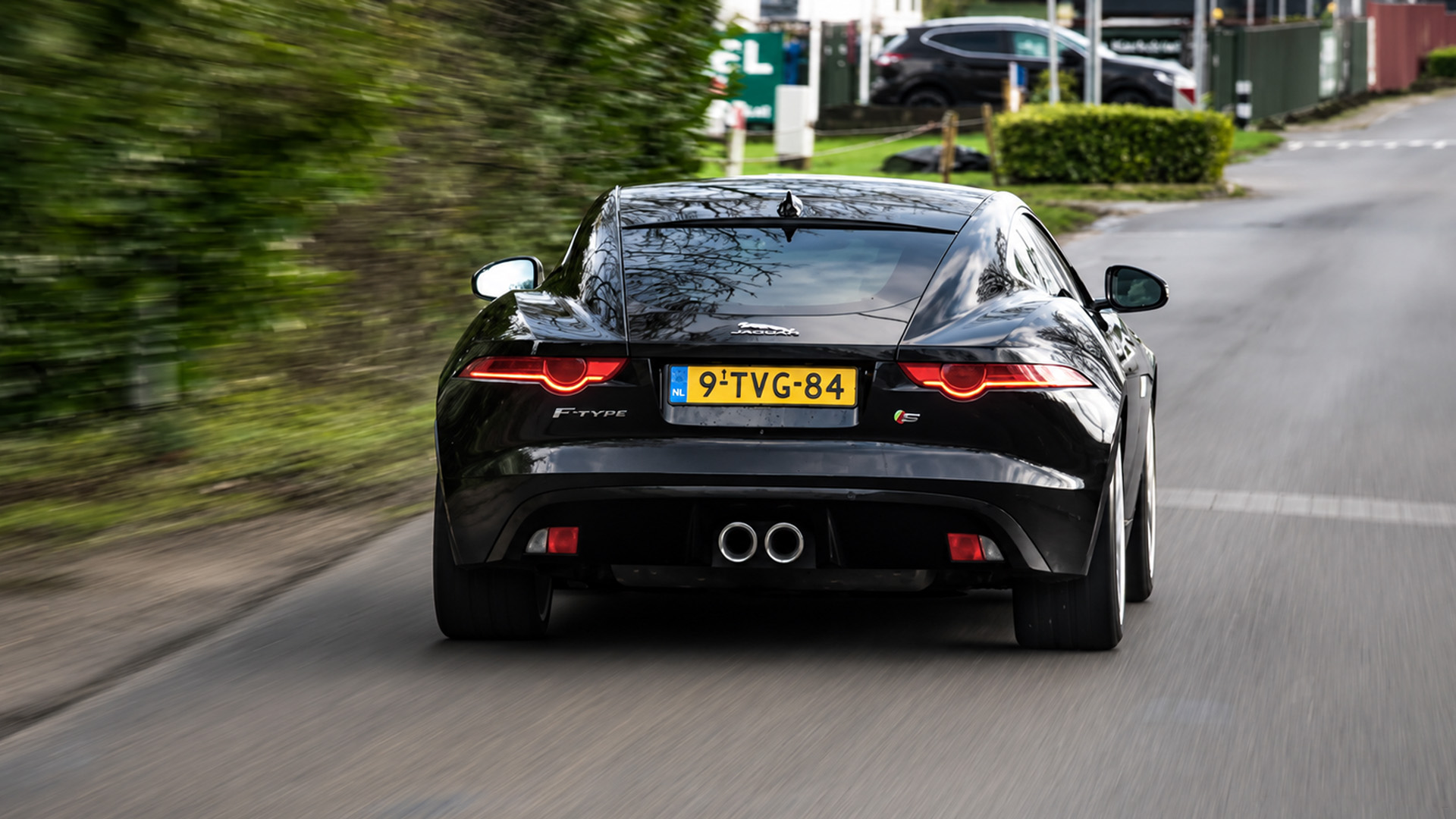 Jaguar F-Type pushes hard through city street