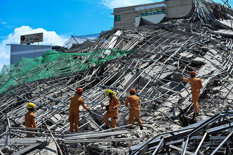 At least one dead in Philippine building collapse, 21 people missing