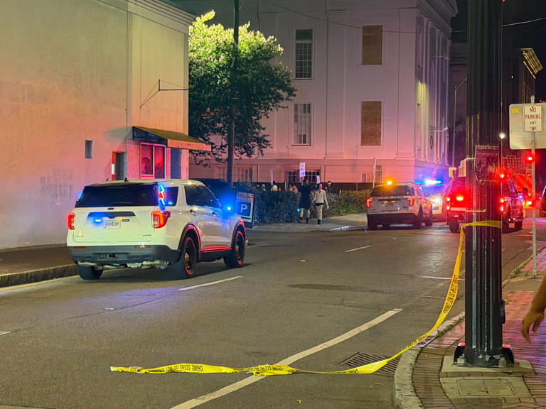 Large police presence on Drayton Street near a parking garage