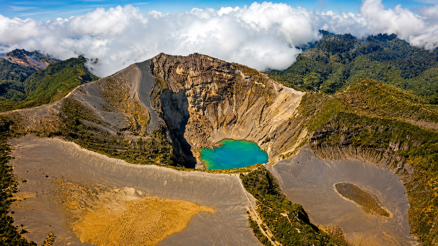 A turquoise crater lake hidden deep inside a volcano