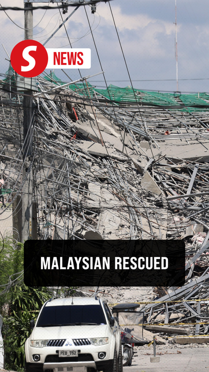Two trapped people alive after Philippines building collapse, rescue ...