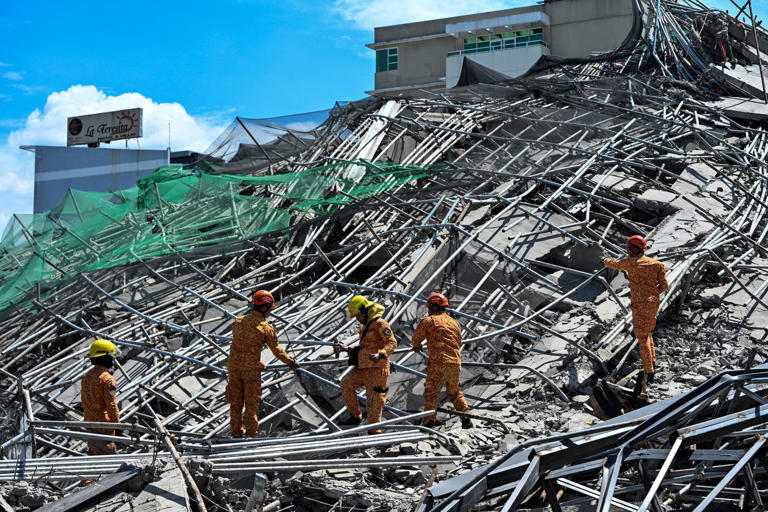 Unfinished Philippines building collapses, 21 missing, Malaysian ...