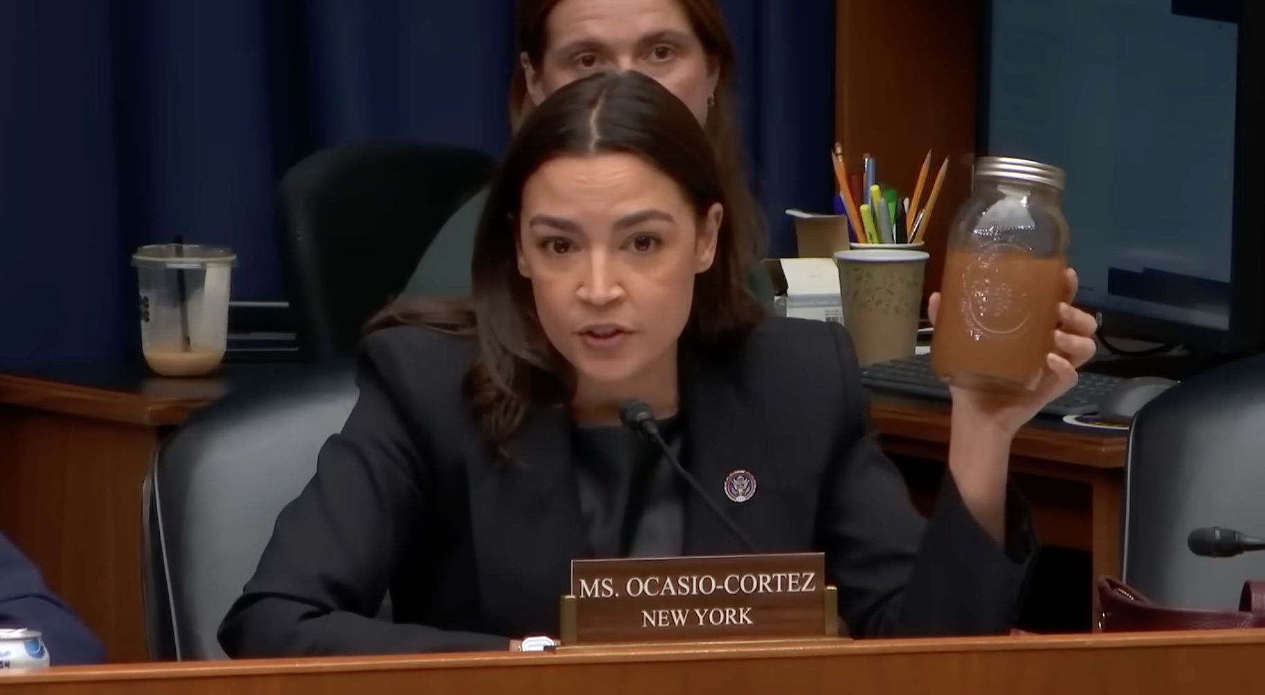 AOC holds jar of brown water from next to Meta's Georgia data center at ...