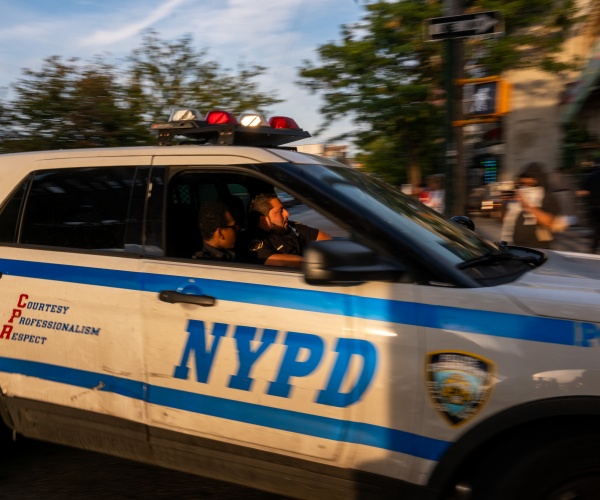 Report: NYPD probes cops pictured flashing gang signs