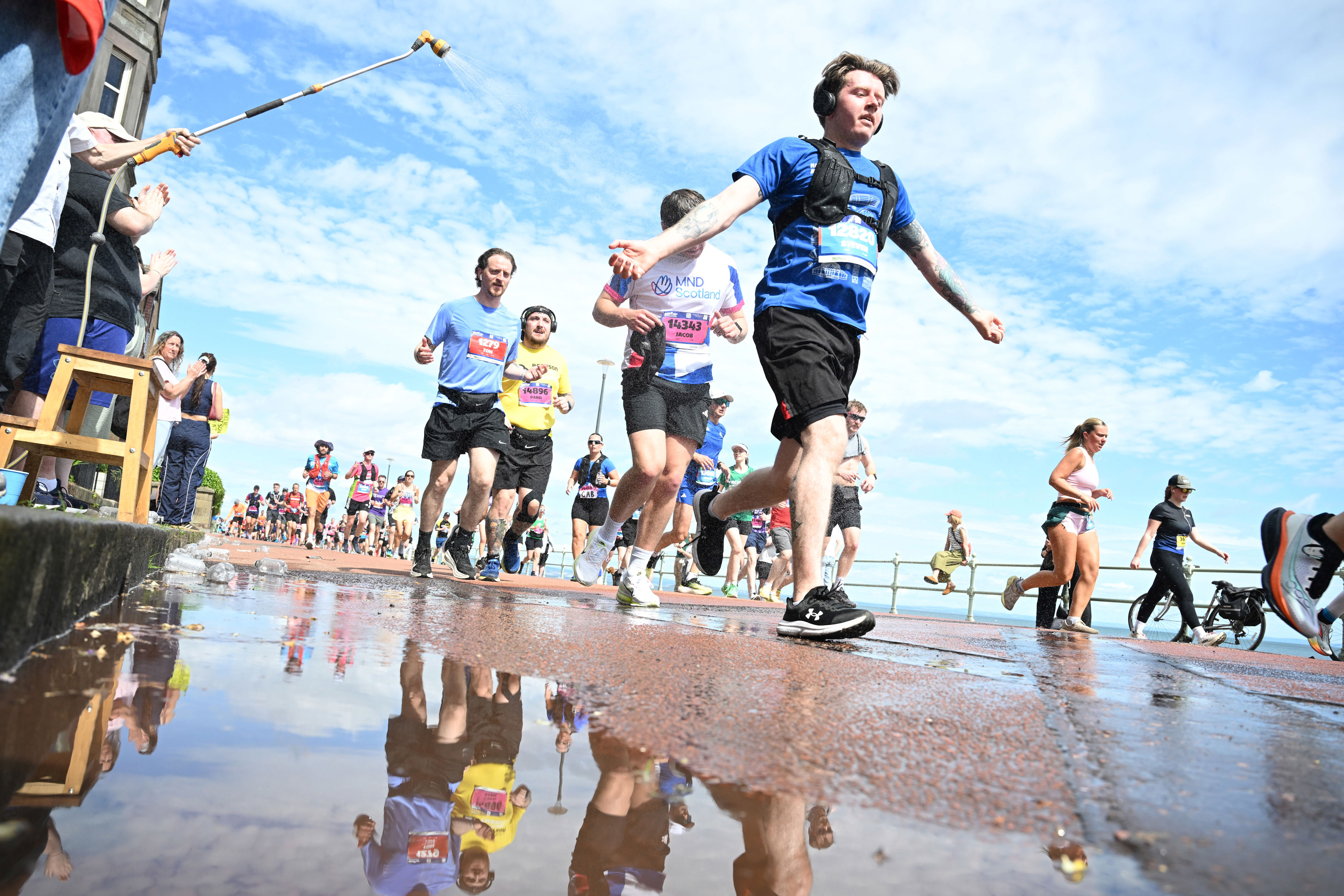 In pictures: Thousands conquer city-to-coast route in sweltering ...