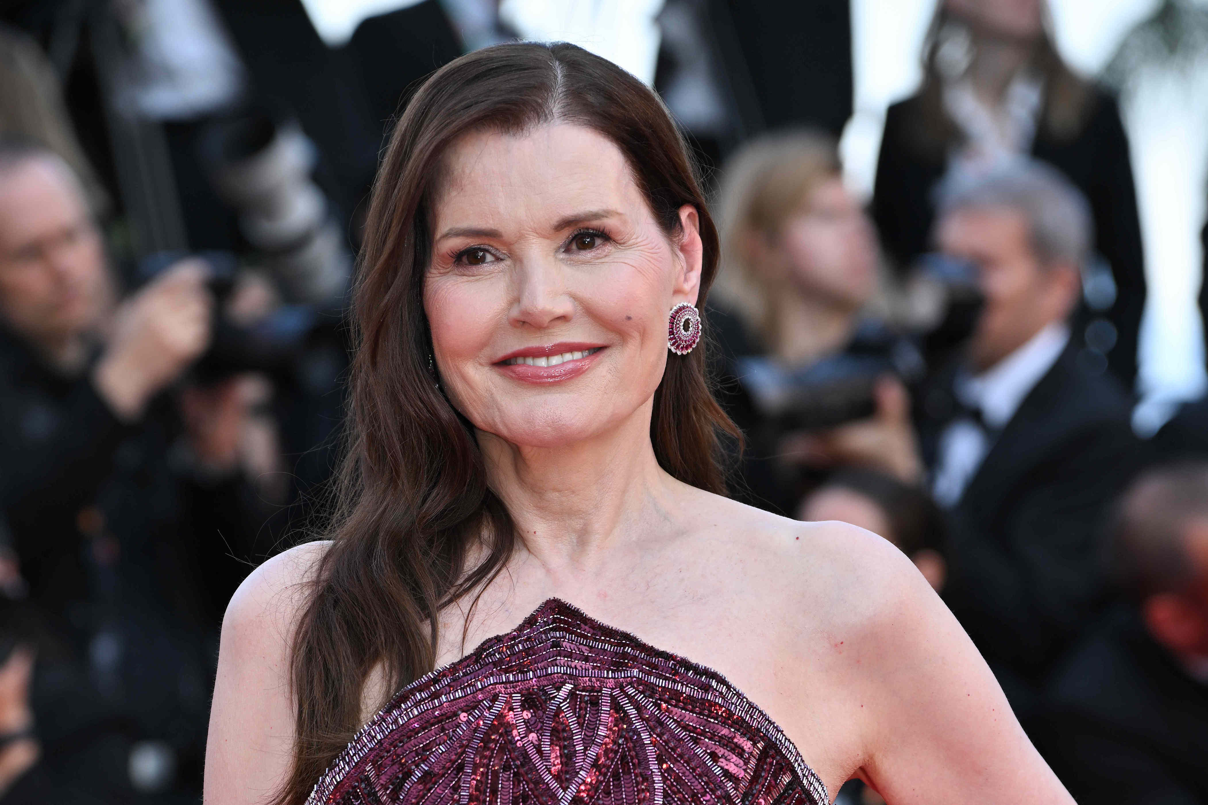 Geena Davis, 70, brings the heat in a firework illusion dress dripping ...