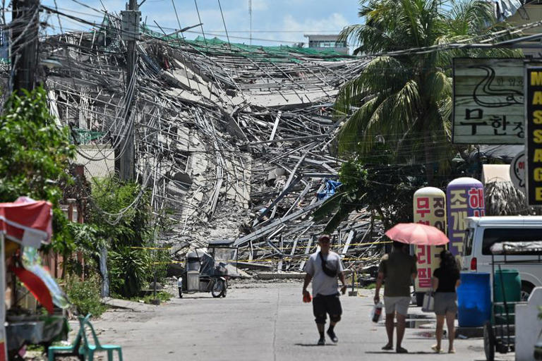 At least one dead in Philippine building collapse, 21 people missing