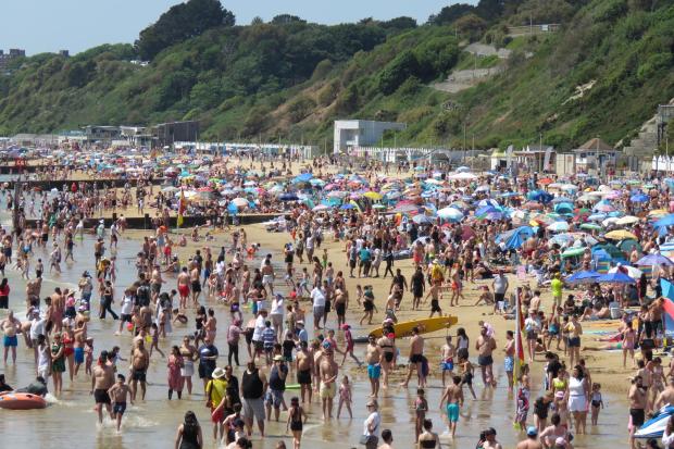 Crowds flock to Bournemouth beach during sweltering bank holiday weekend
