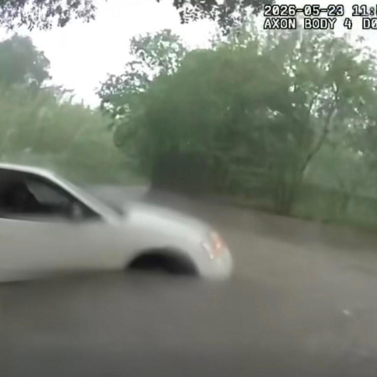 Video shows infant being rescued from car trapped in floodwaters