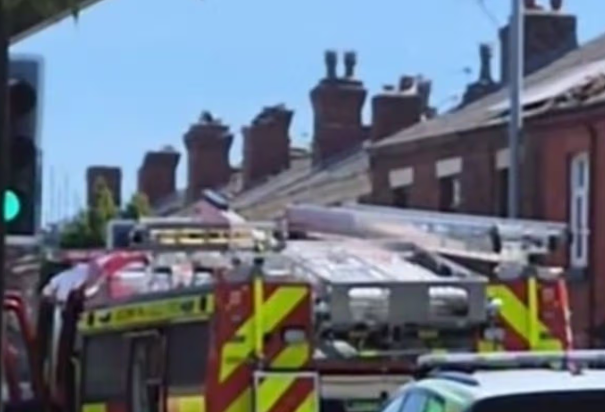 Police in six-hour stand-off with man on roof 'throwing bricks and ...