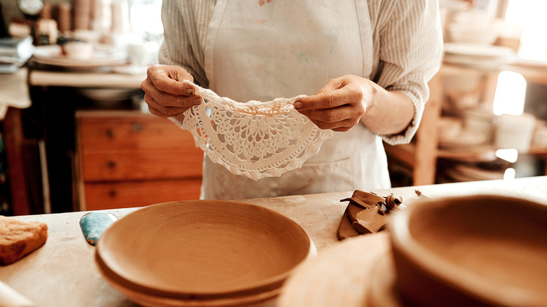 She grabs a vintage doily and turns it into the most unique plant hanger