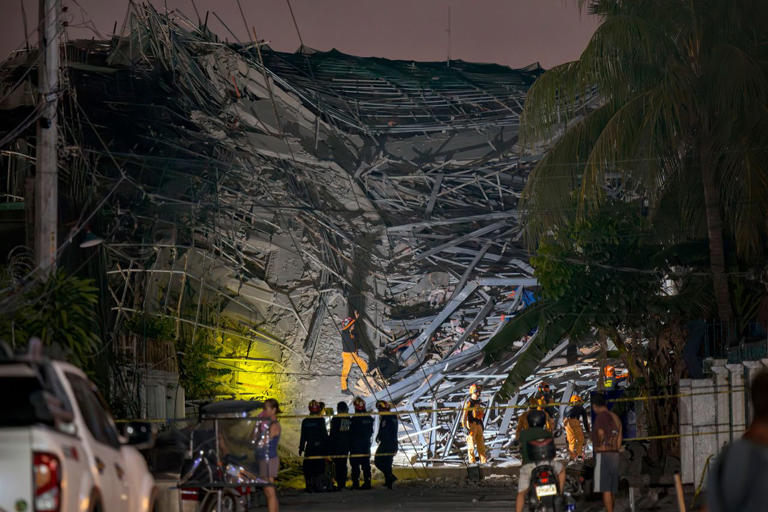 At least 21 people trapped after 9-story building under construction ...