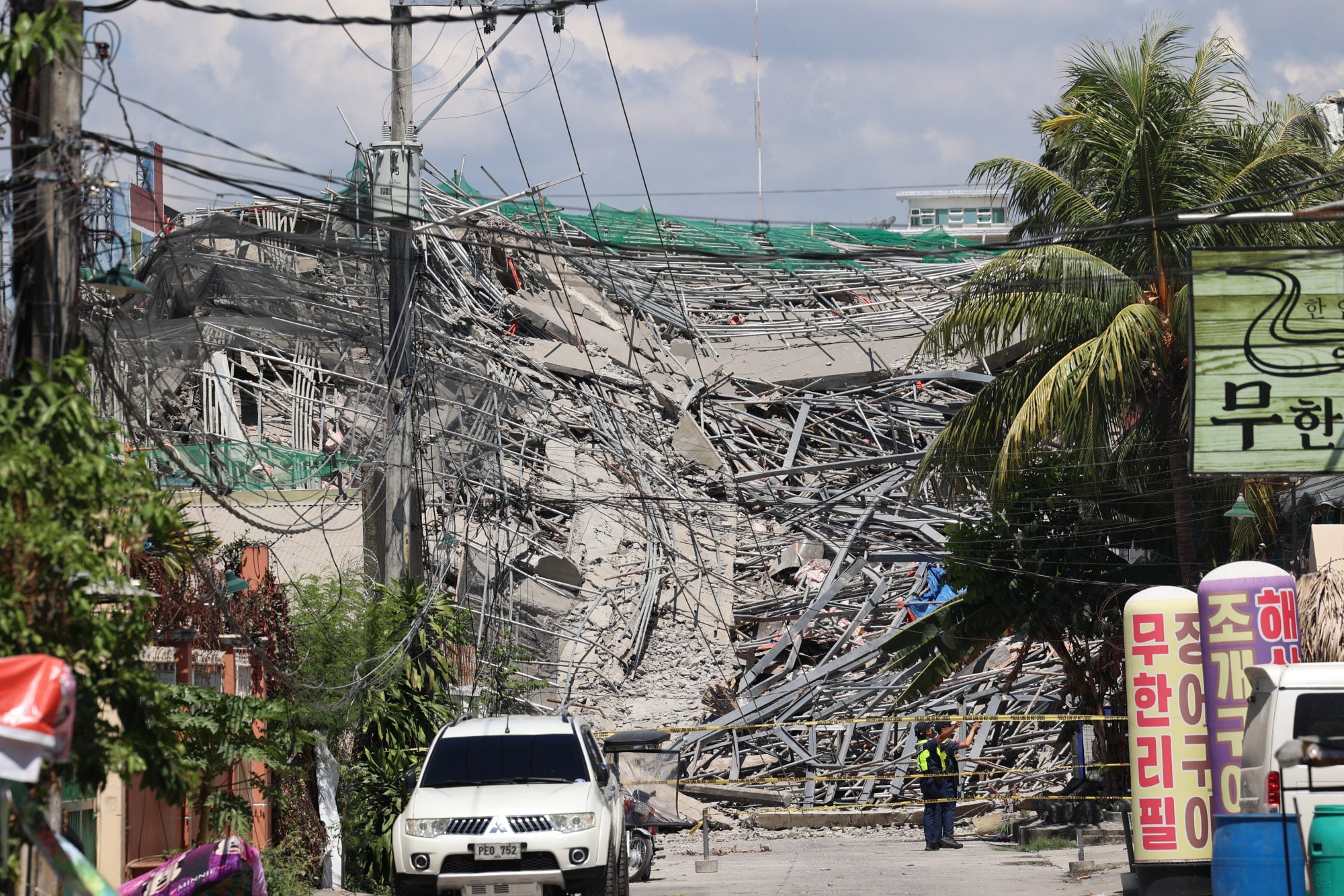 Unfinished Philippines building collapses, 21 missing, Malaysian ...