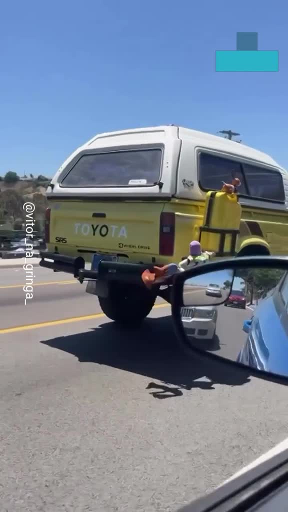 Toy Story characters dangle from a moving car in famous scene remake