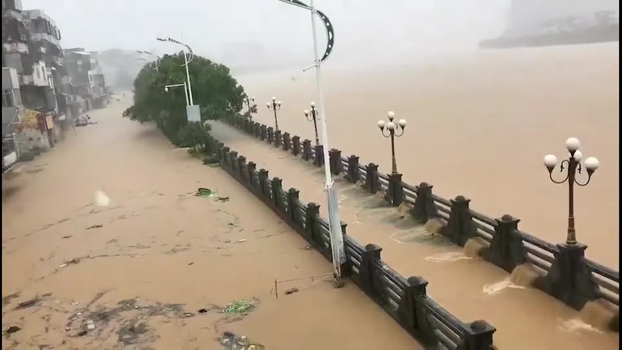Severe flooding submerges riverside walkway at Moyang River, Guangdong ...