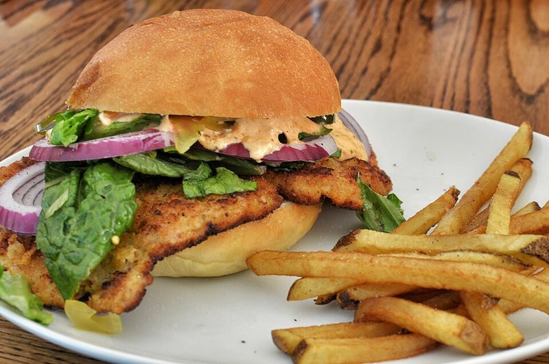 This tiny Indiana tavern serves a burger so big it looks illegal