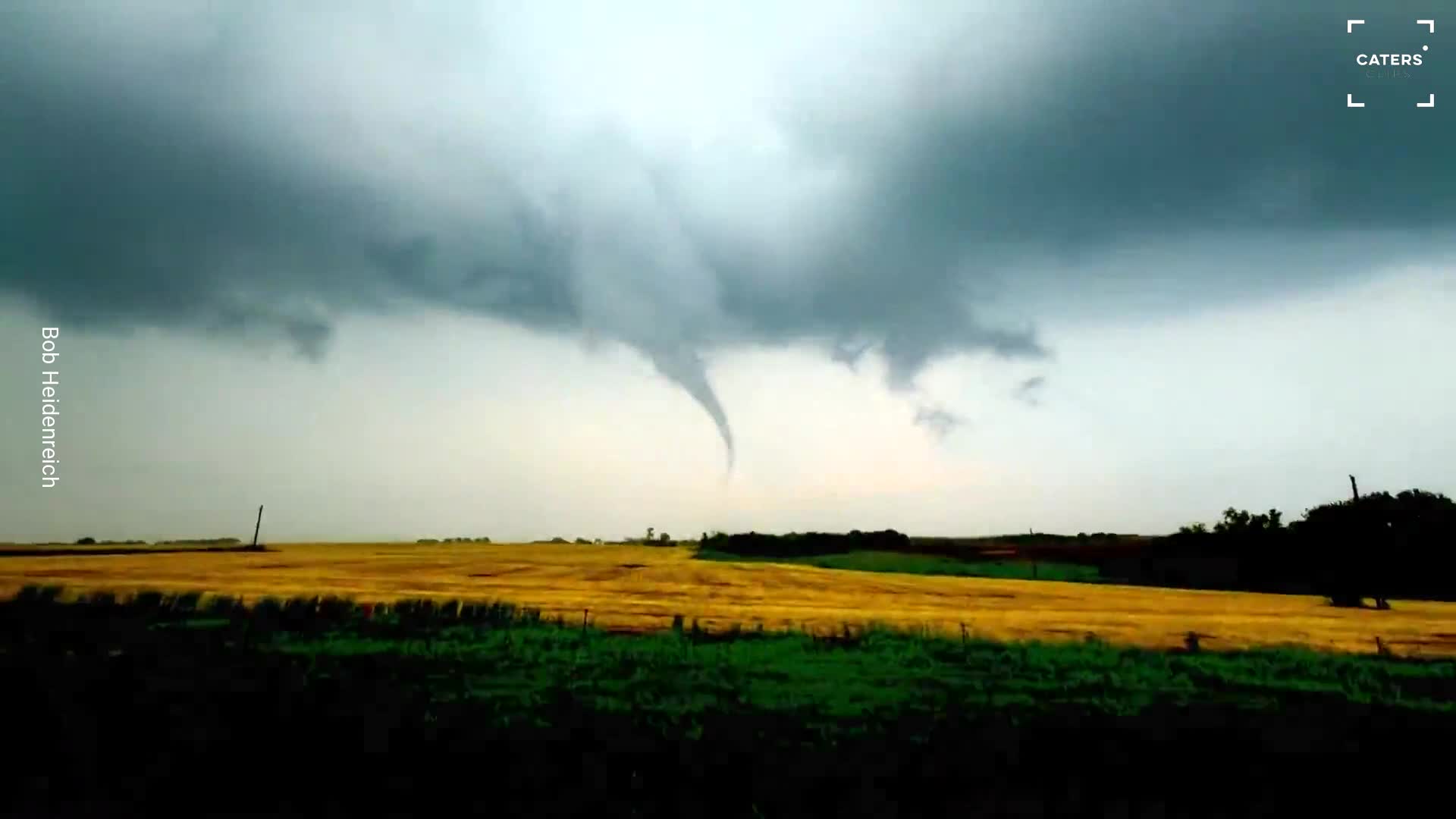 Tornado spirals down over farmland in Kansas