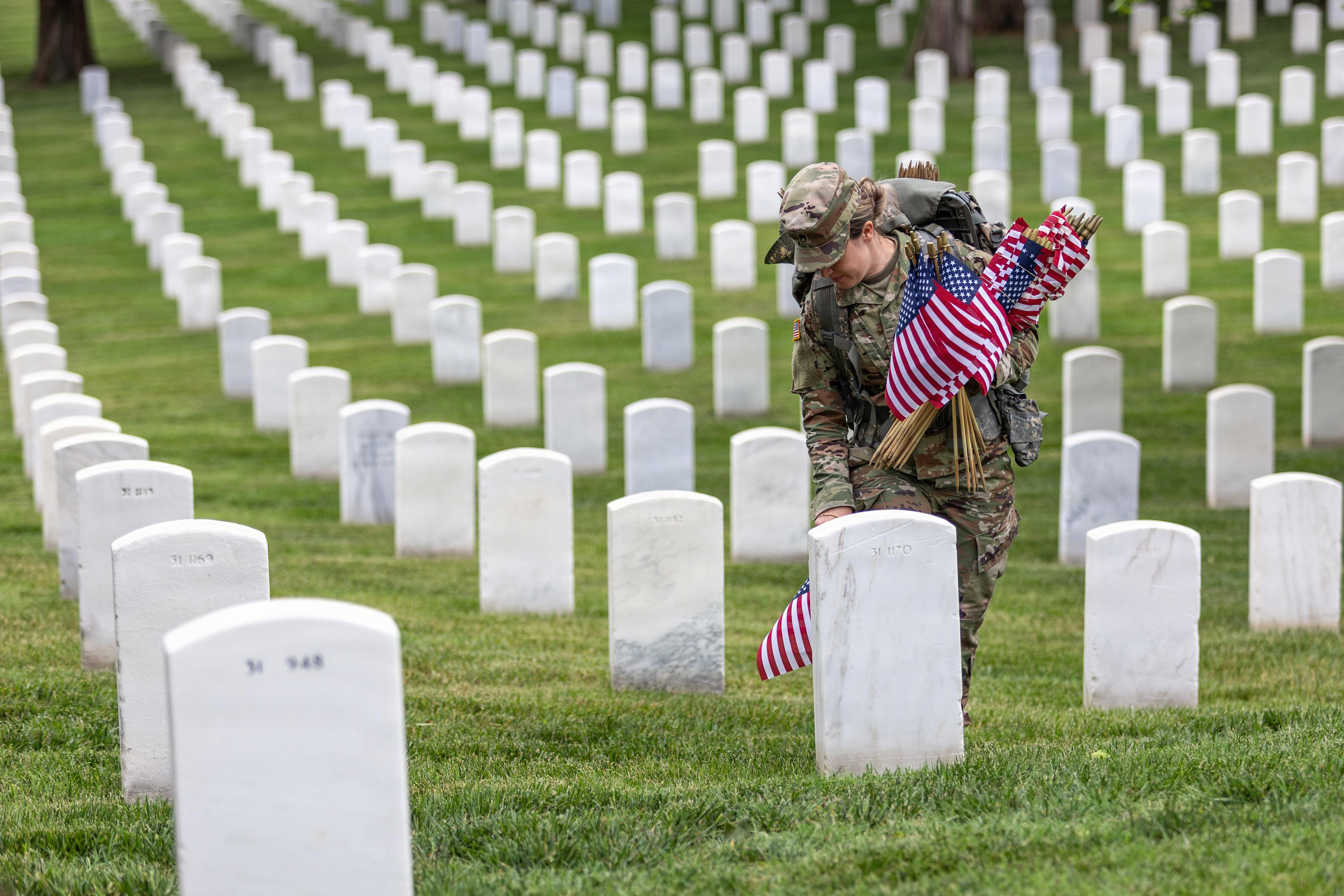 Army's Old Guard places flags at Arlington National Cemetery