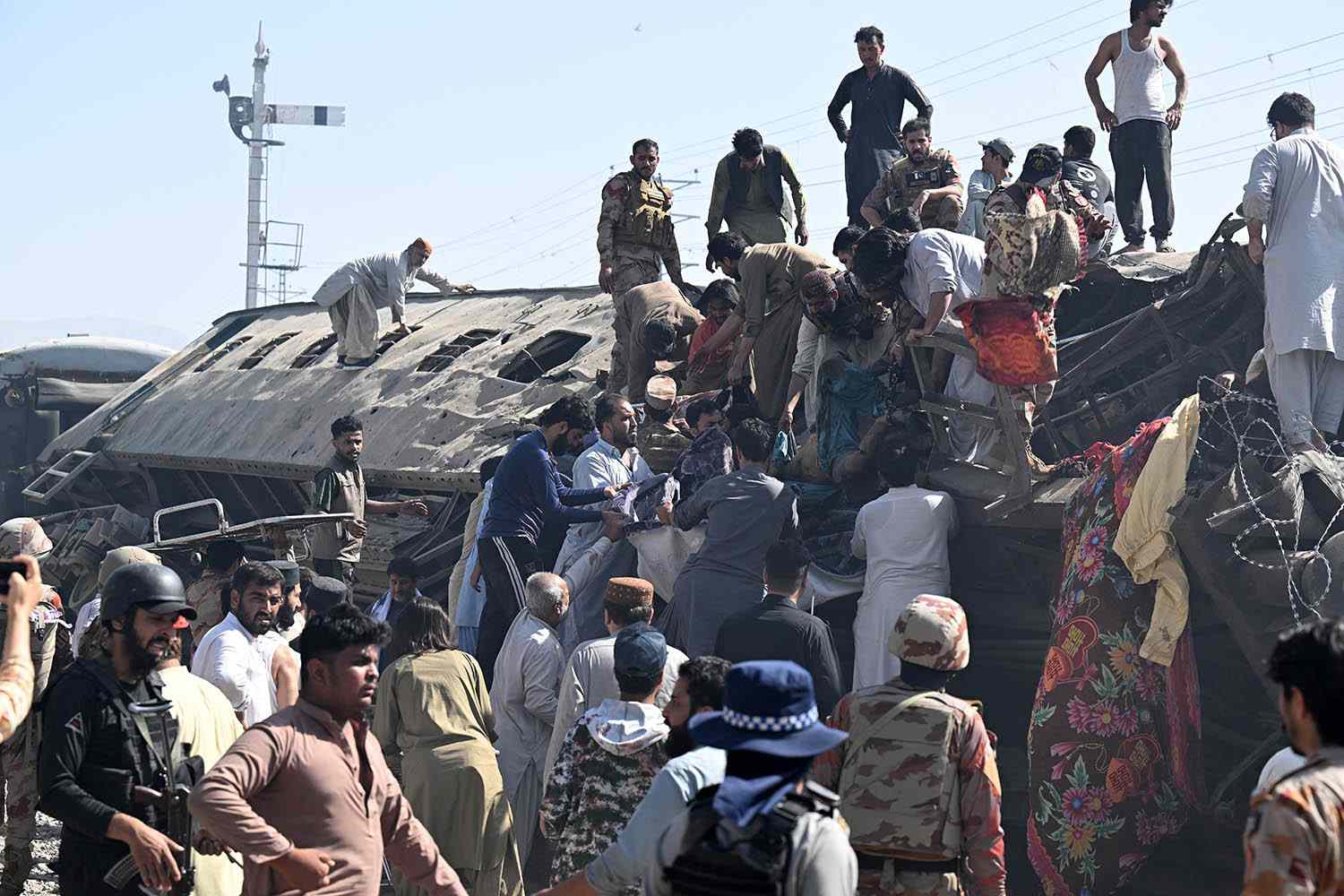 At least 14 people killed in bombing attack near moving passenger train