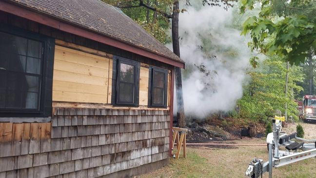 Sebago shed fire scorches nearby woods