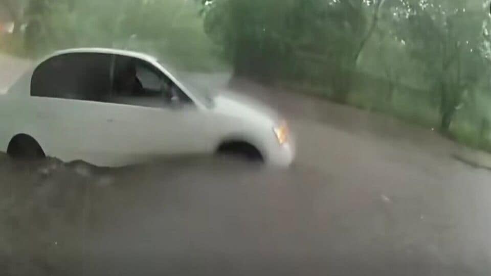 Texas police officers rush into raging floodwaters to save infant ...